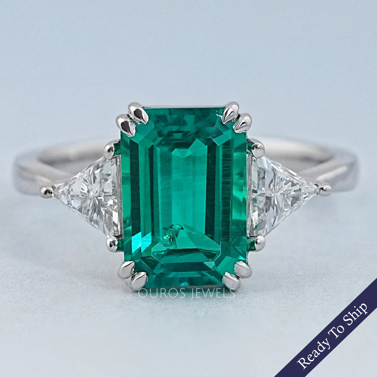 Emerald And Triangle Cut Trio Engagement Ring — Ouros Jewels